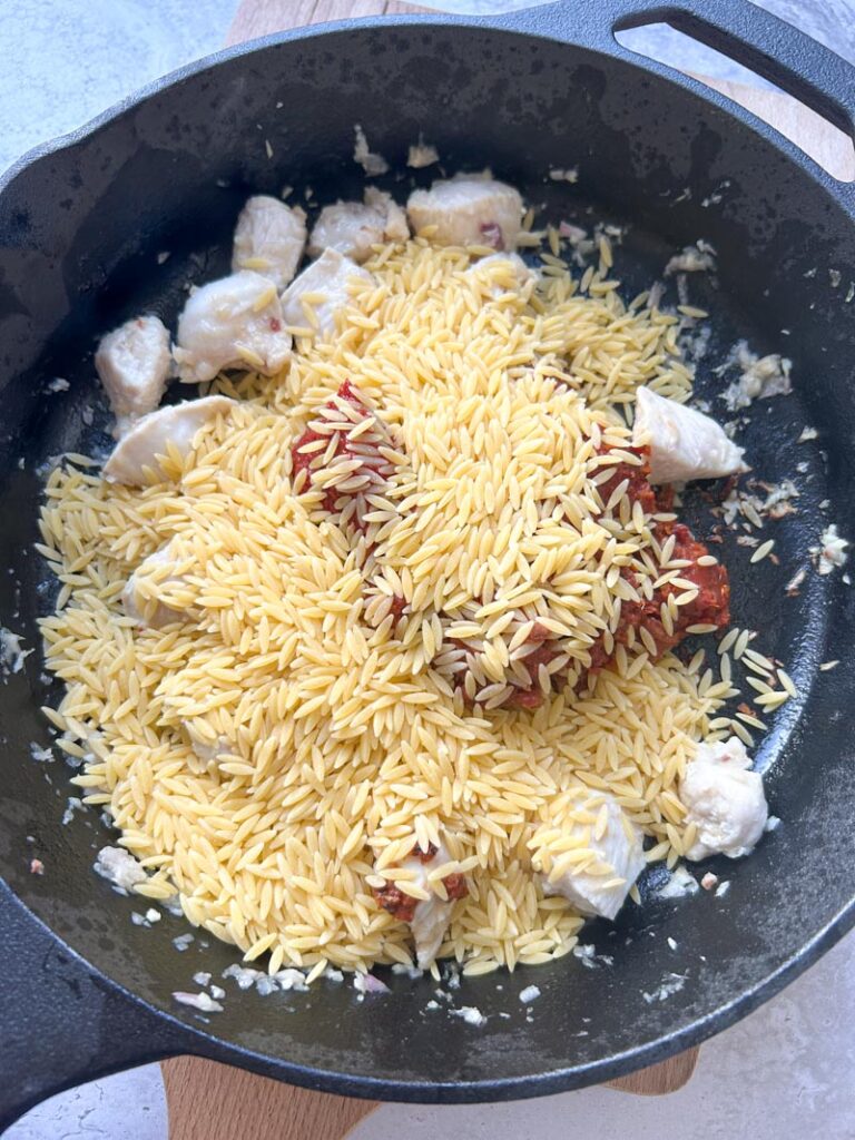 Creamy cajun chicken orzo recipe in a skillet - Marie Food Tips